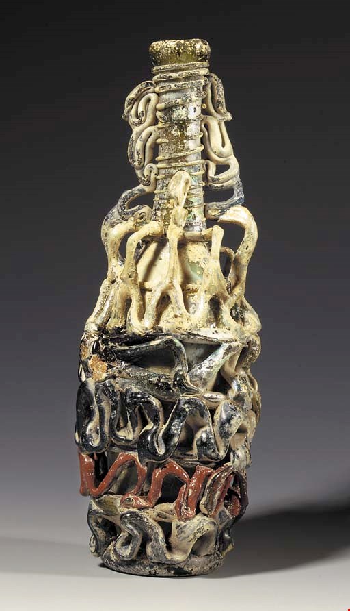 A PALE GREEN GLASS BOTTLE , EARLY ISLAMIC, PROBABLY PERSIA, 7TH/8TH ...