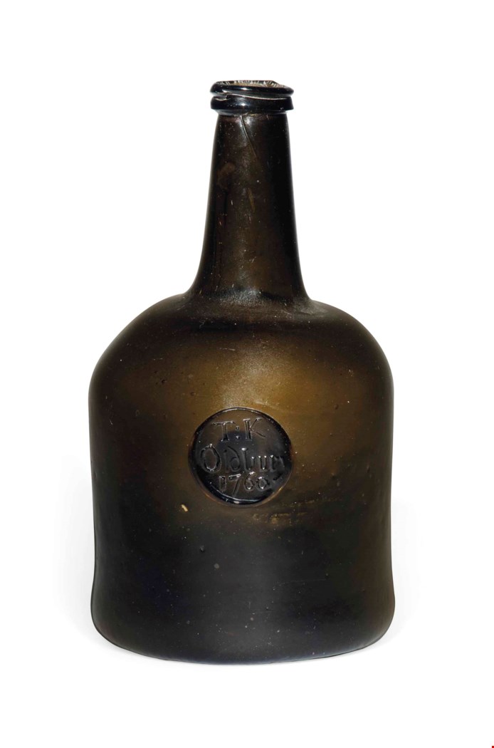 AN ENGLISH GLASS SEALED WINE BOTTLE , DATED 1760 | Christie's