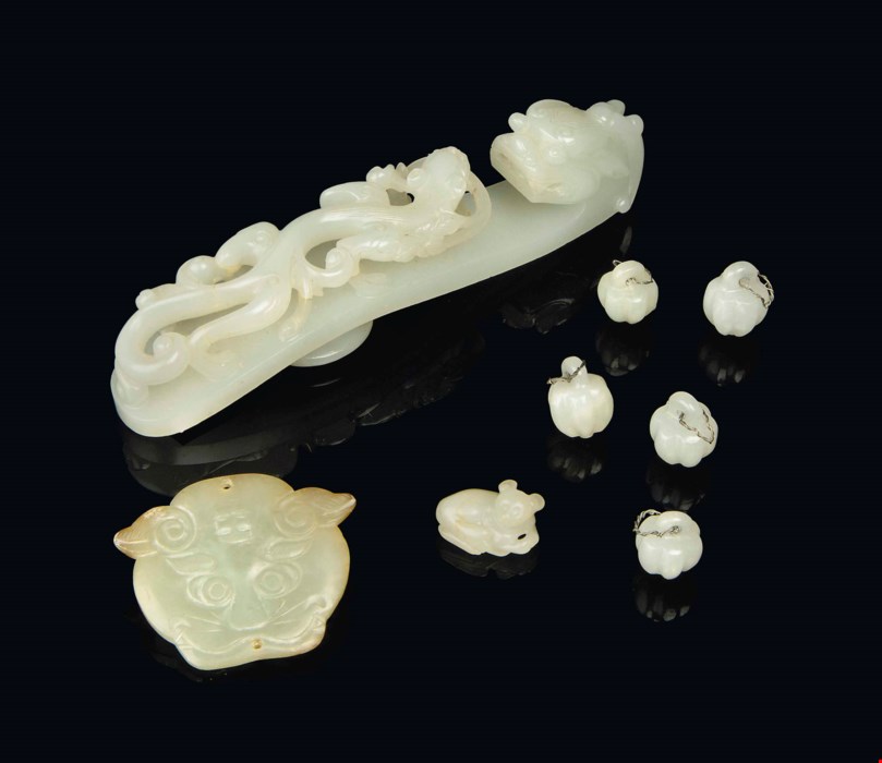 A SMALL WHITE JADE CAT, A WHITE JADE BELTHOOK, A CELADON JADE 'CAT ...