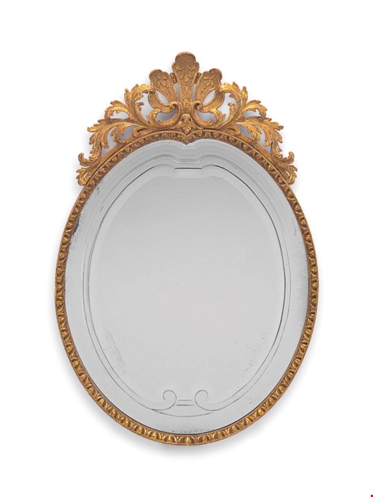 A GEORGE I GILTWOOD OVAL MIRROR, CIRCA 1720 | Christie's