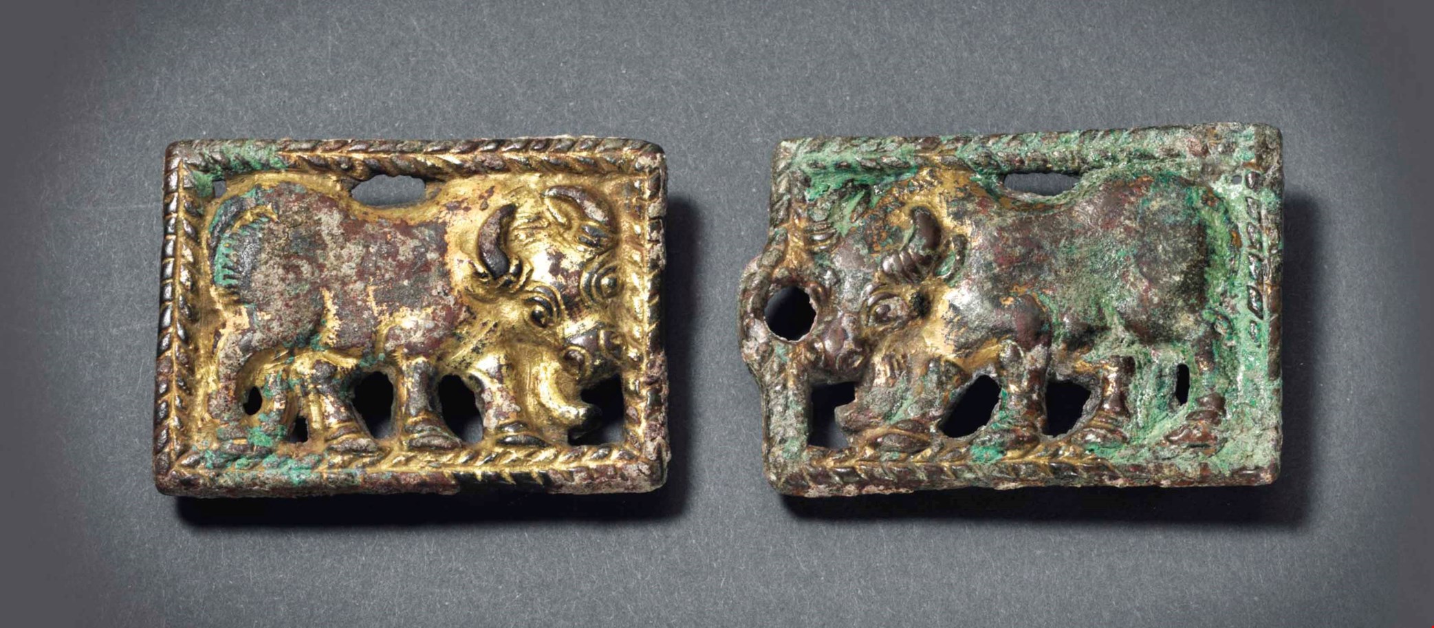 TWO GILT-BRONZE BELT BUCKLES WITH OXEN, NORTH CHINA, 3RD-2ND CENTURY BC ...