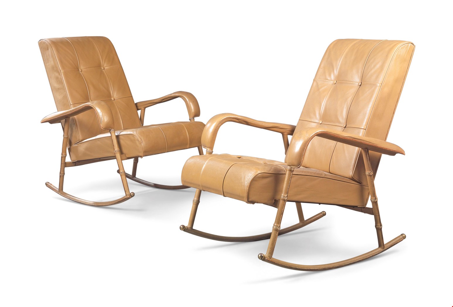 A PAIR OF LEATHER AND BRASS ROCKING ARMCHAIRS, BY JACQUES ADNET (1900 ...