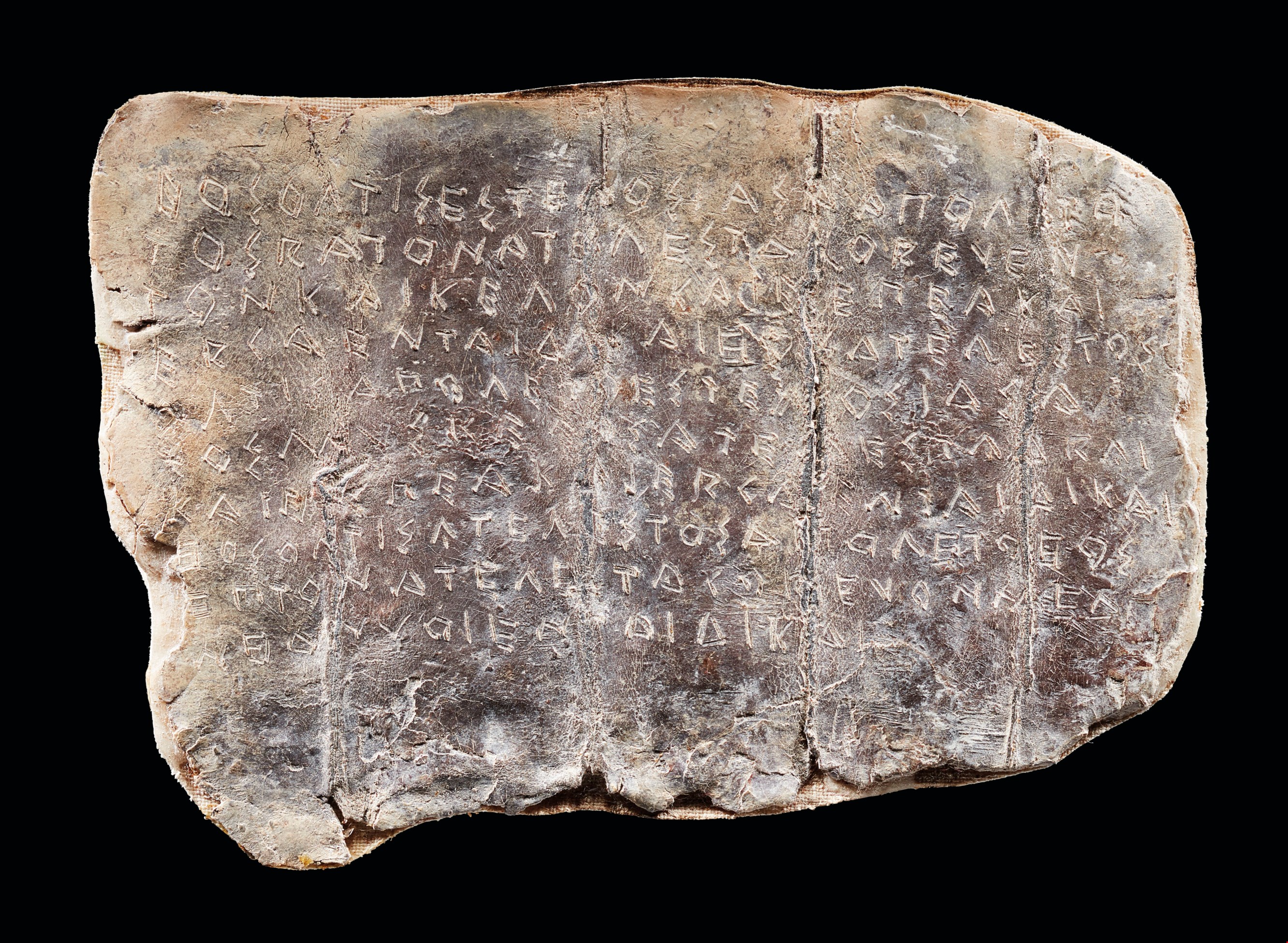 A DORIC GREEK INSCRIBED LEAD CURSE TABLET, CIRCA 5TH CENTURY B.C ...