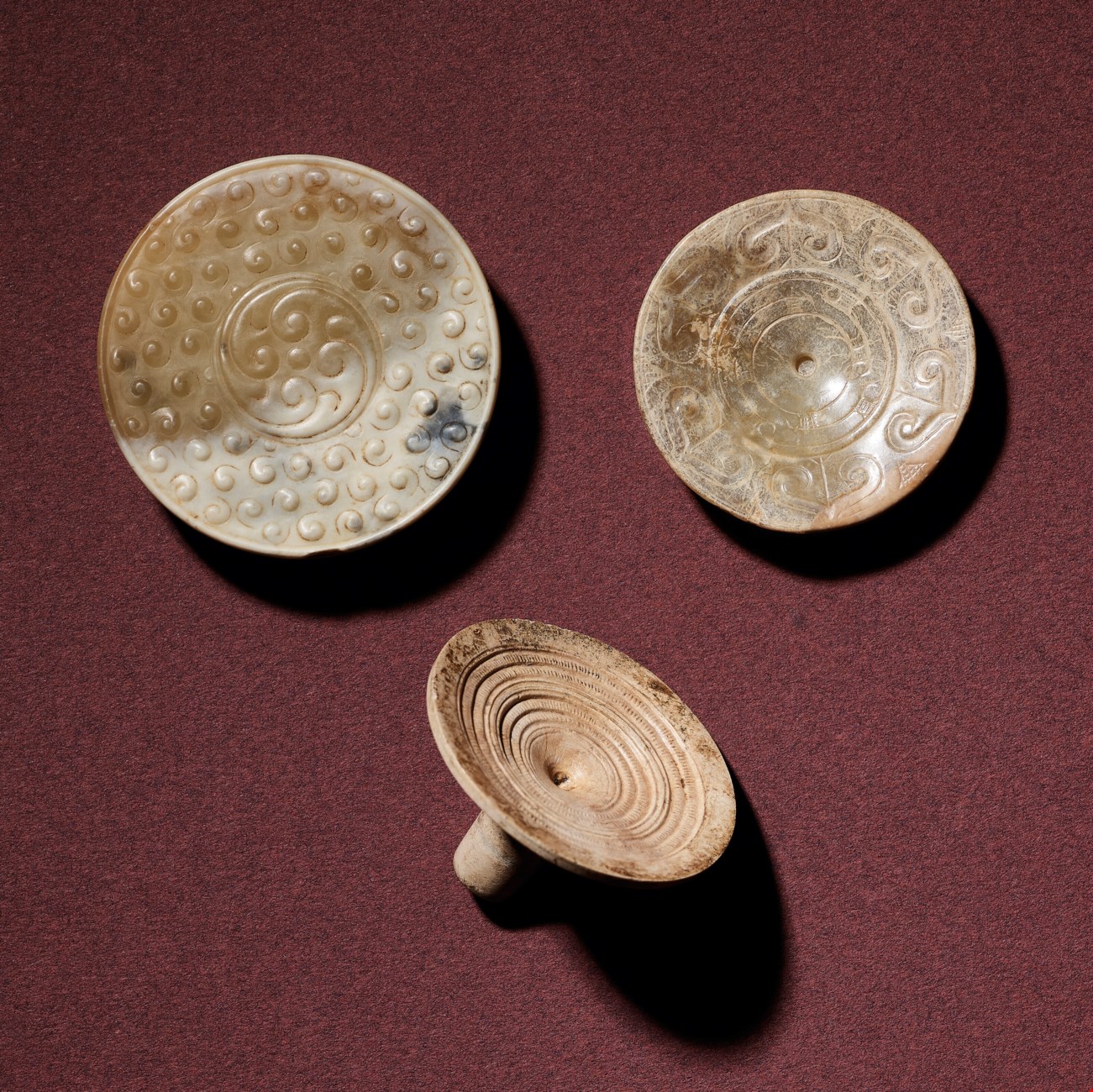 THREE JADE SWORD POMMELS, WESTERN HAN DYNASTY (206 BC-AD 8) | Christie's